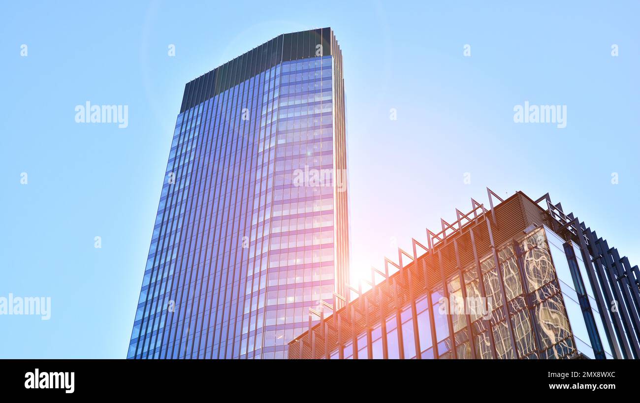 Architecture details. Modern glass building facade in sunny day ...