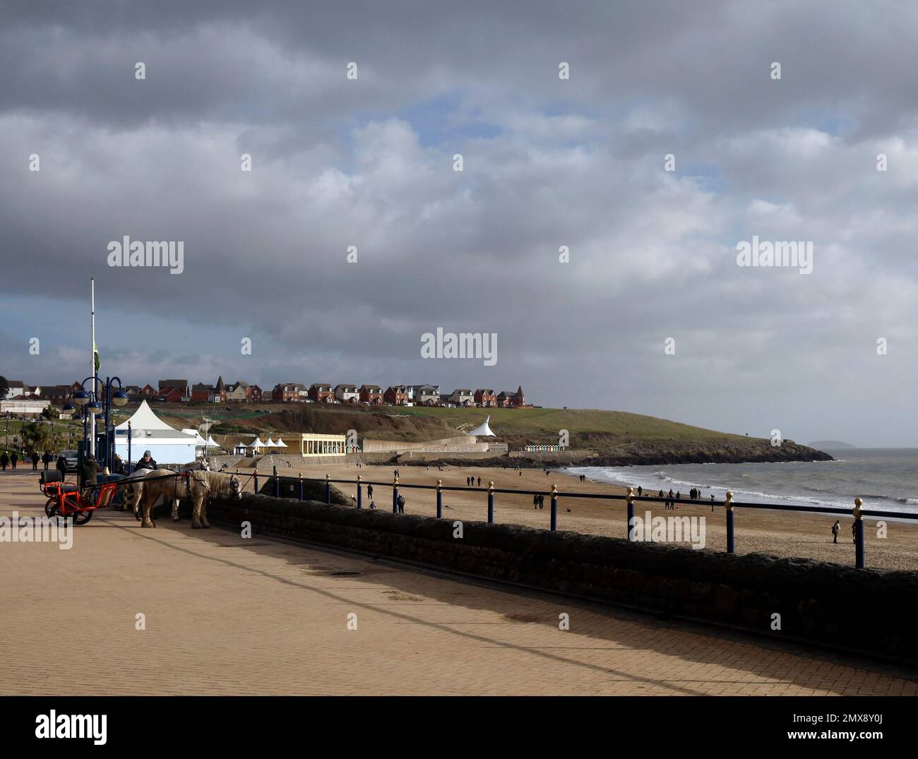Ponies pulling training carts (Sulky, roadsters) tethered to the promenade railings at Barry ...