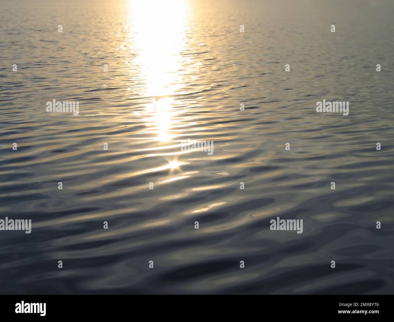 Sunset reflected on water background, natural texture Stock Photo - Alamy
