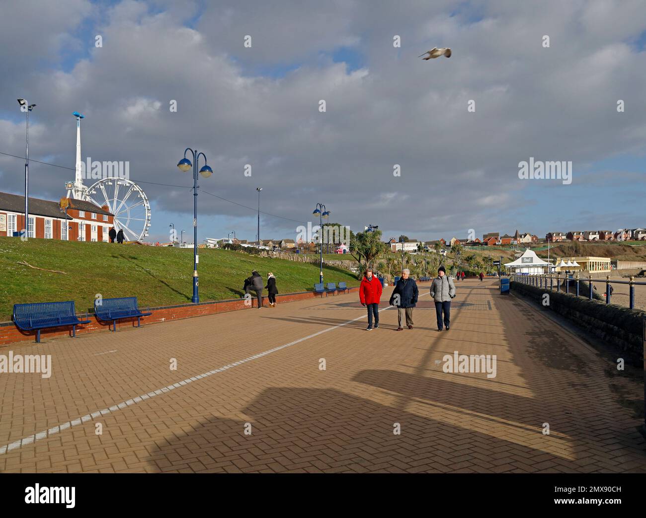 Three women walking on the promenade, Barry Island. January 2023. Winter Stock Photo - Alamy