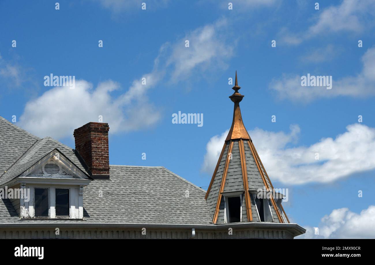 Victorian home grey shingles with turret. Turret is trimmed in copper ...