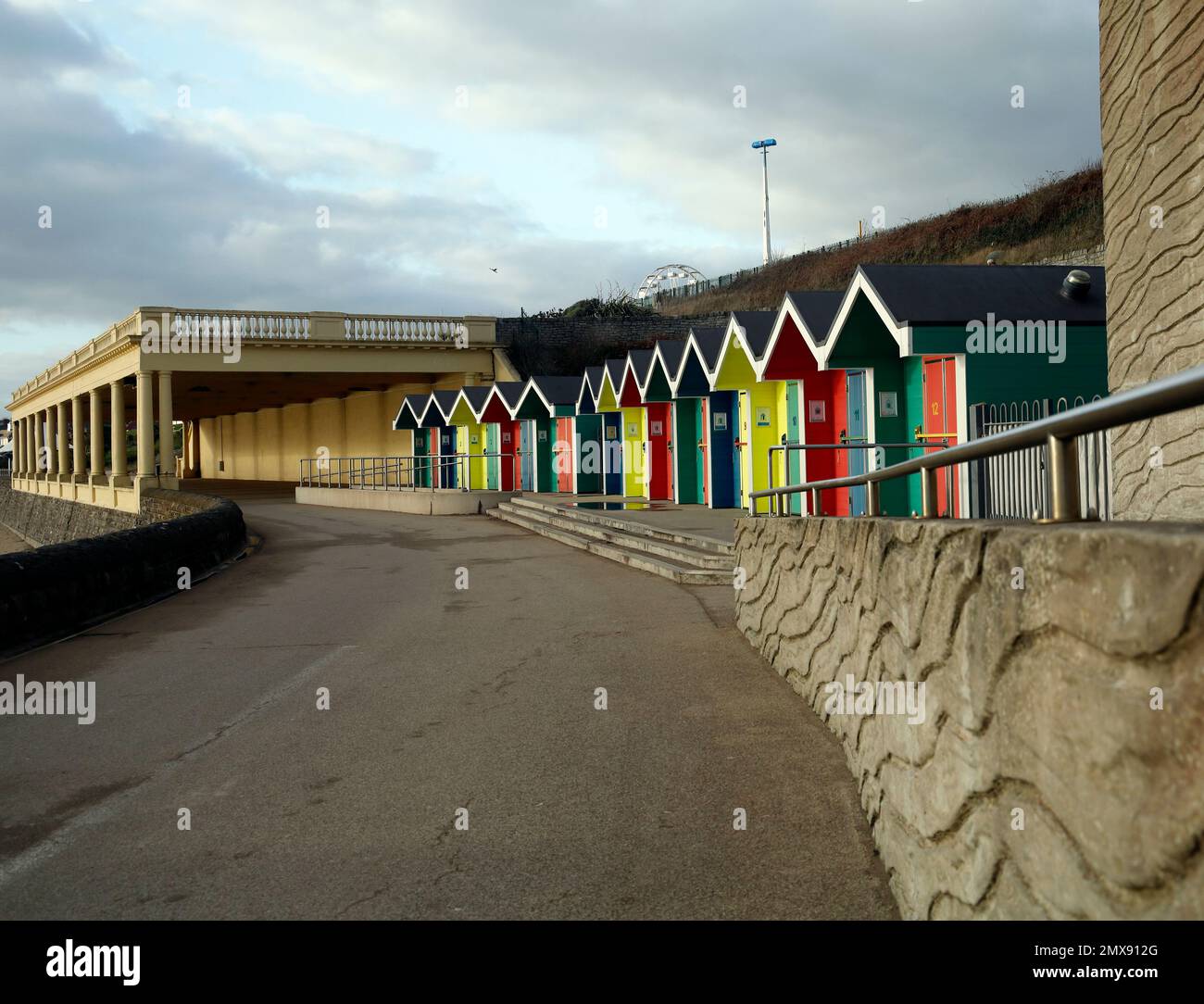 Abstract patterns formed by concrete walls, beach huts and pavilion at Barry Island. January ...