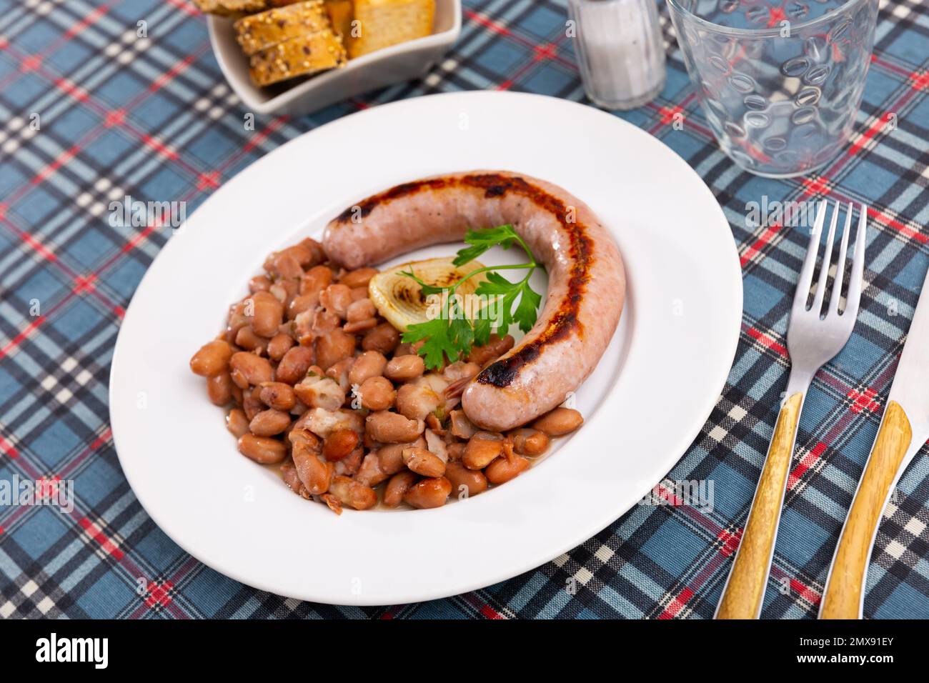 Traditional Catalan dish stewed beans with sausage. Butifarra con ...
