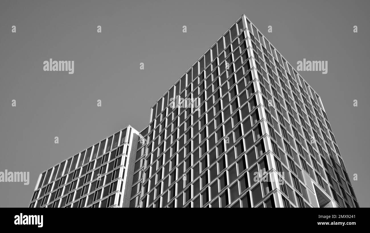 Commercial building close up in blue tone. Gigantic skyscraper from ...