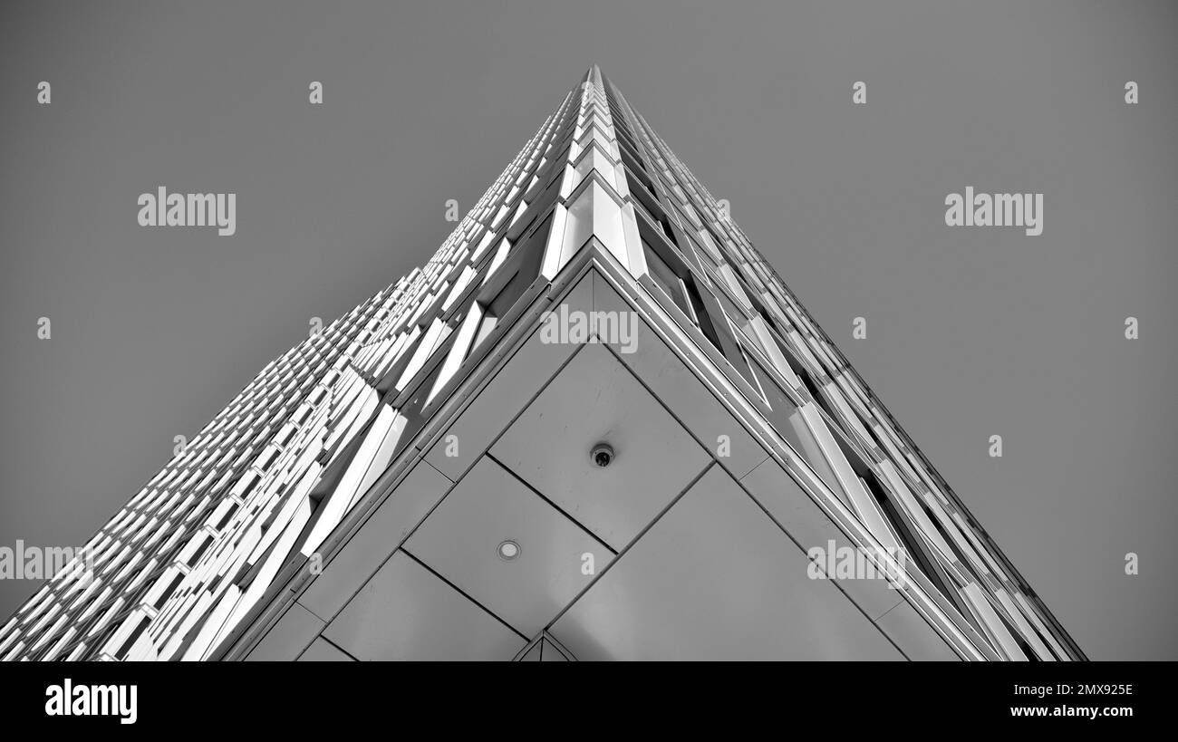 Commercial building close up in blue tone. Gigantic skyscraper from ...