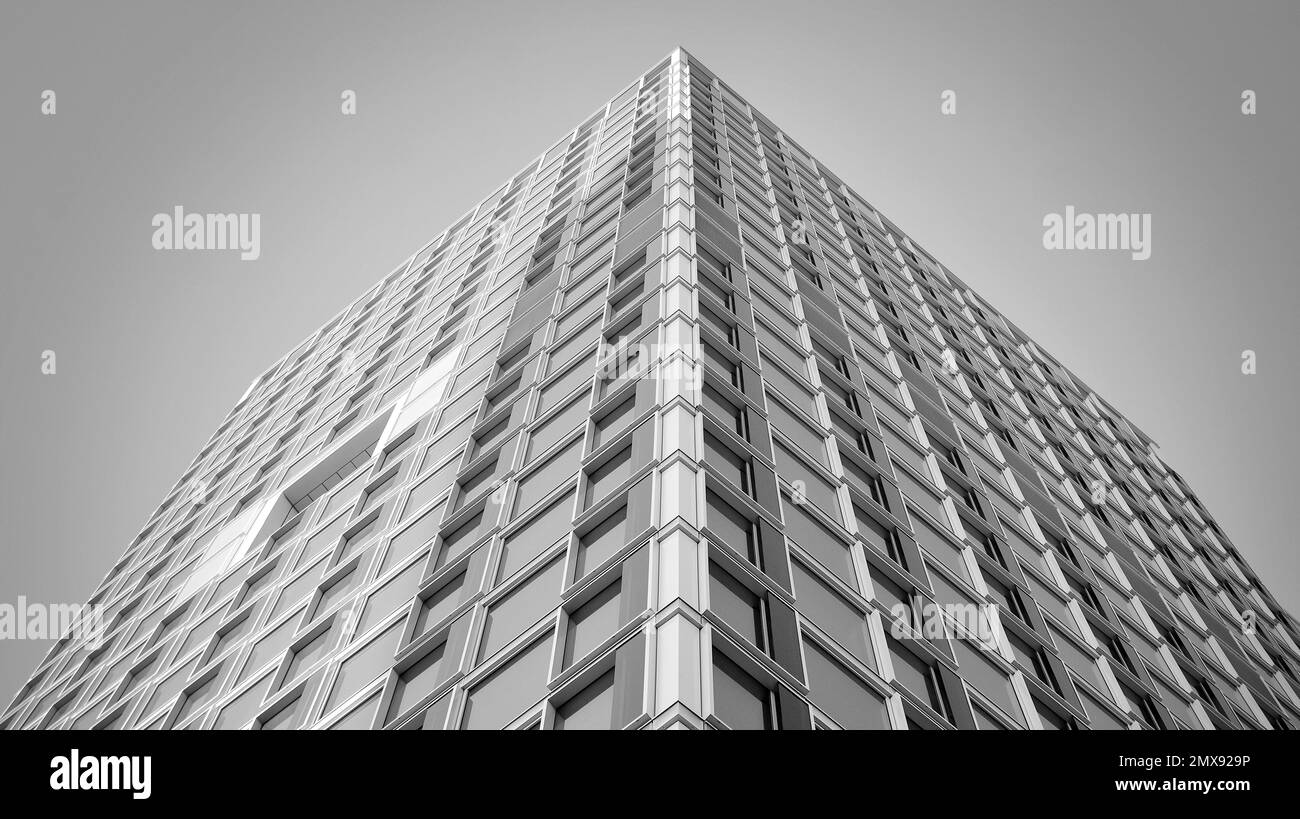 Commercial building close up in blue tone. Gigantic skyscraper from ...
