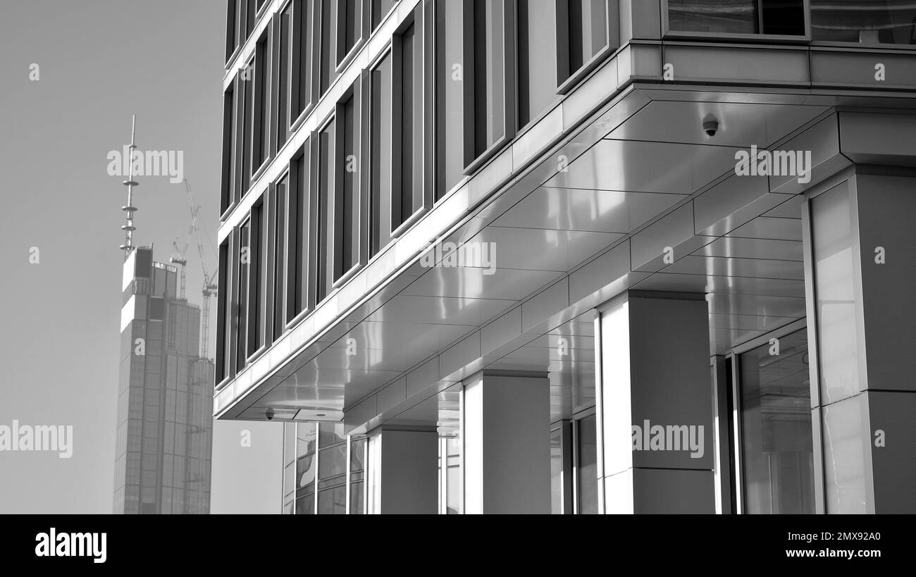 Commercial building close up in blue tone. Gigantic skyscraper from ...