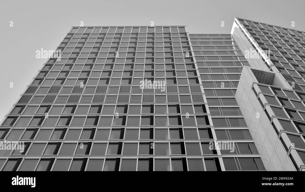 Commercial building close up in blue tone. Gigantic skyscraper from ...