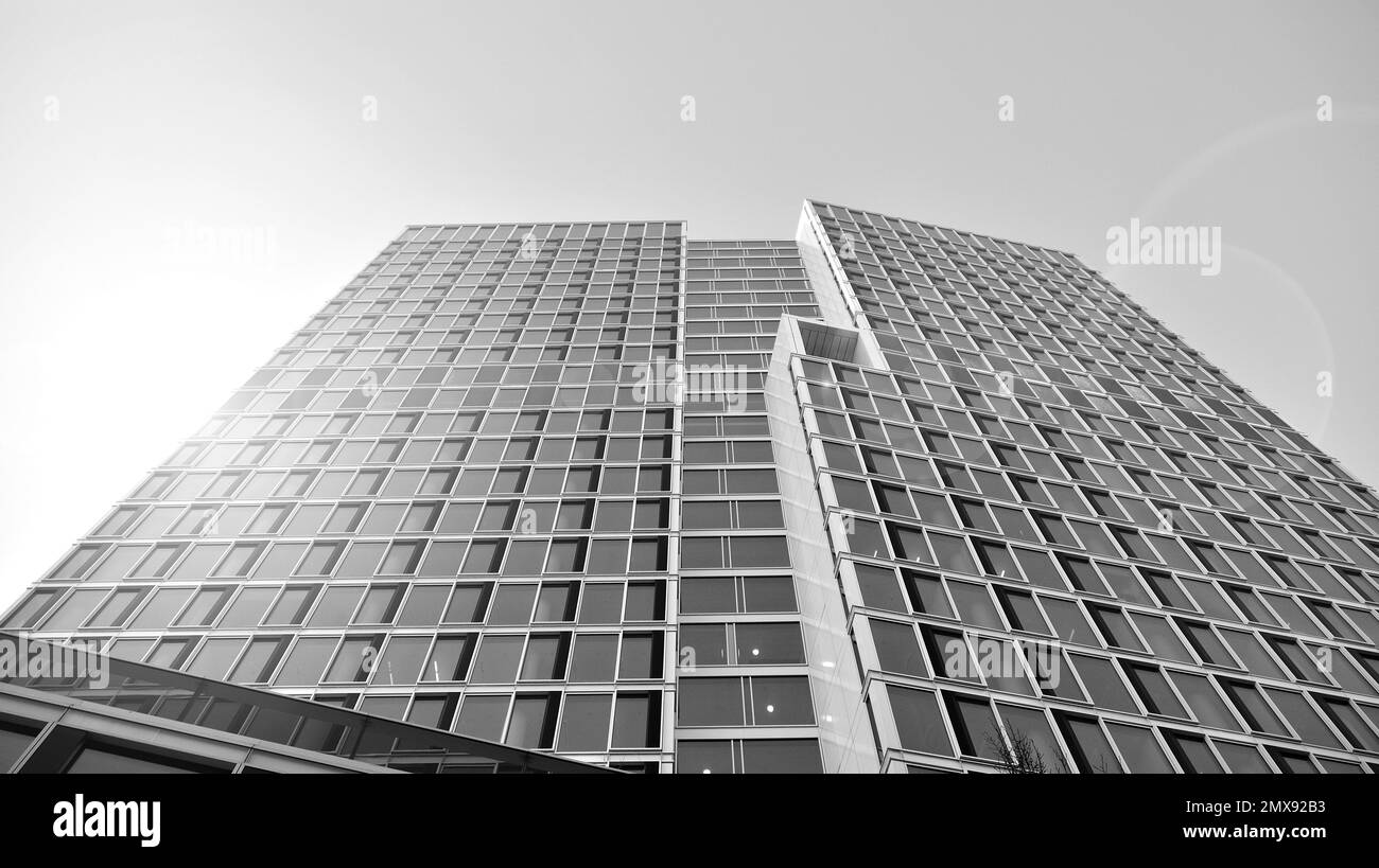 Commercial building close up in blue tone. Gigantic skyscraper from ...