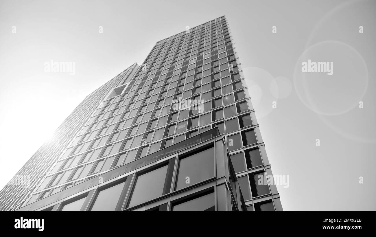 Commercial building close up in blue tone. Gigantic skyscraper from ...