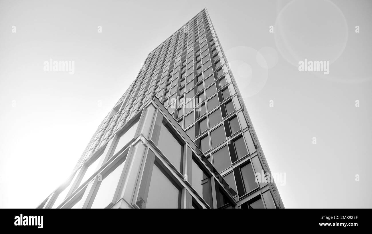 Commercial building close up in blue tone. Gigantic skyscraper from ...