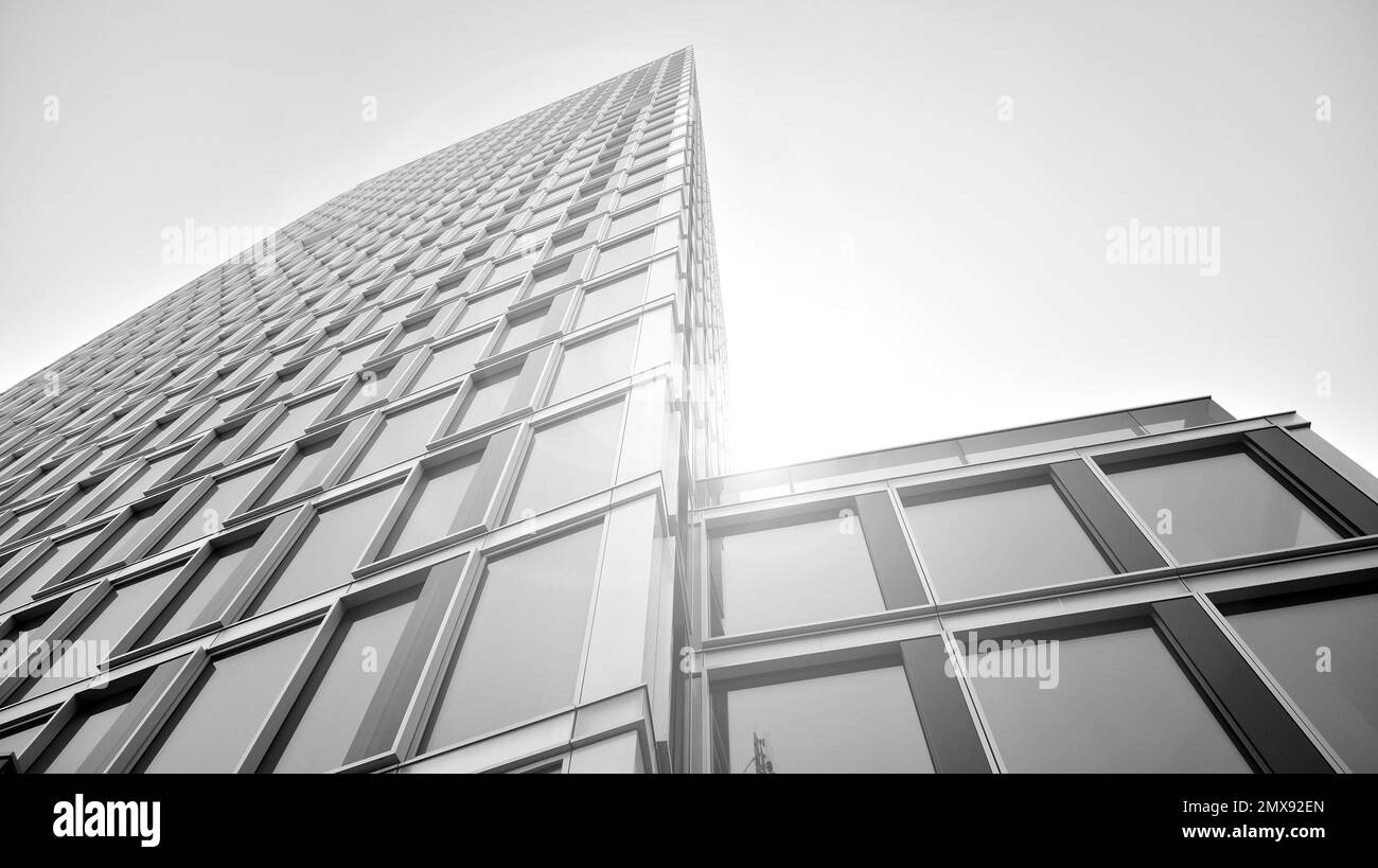 Commercial building close up in blue tone. Gigantic skyscraper from ...