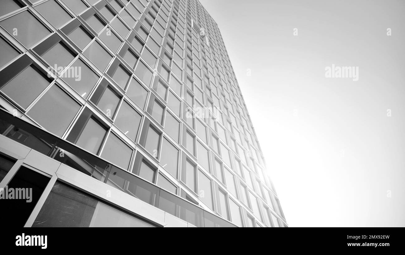 Commercial building close up in blue tone. Gigantic skyscraper from ...
