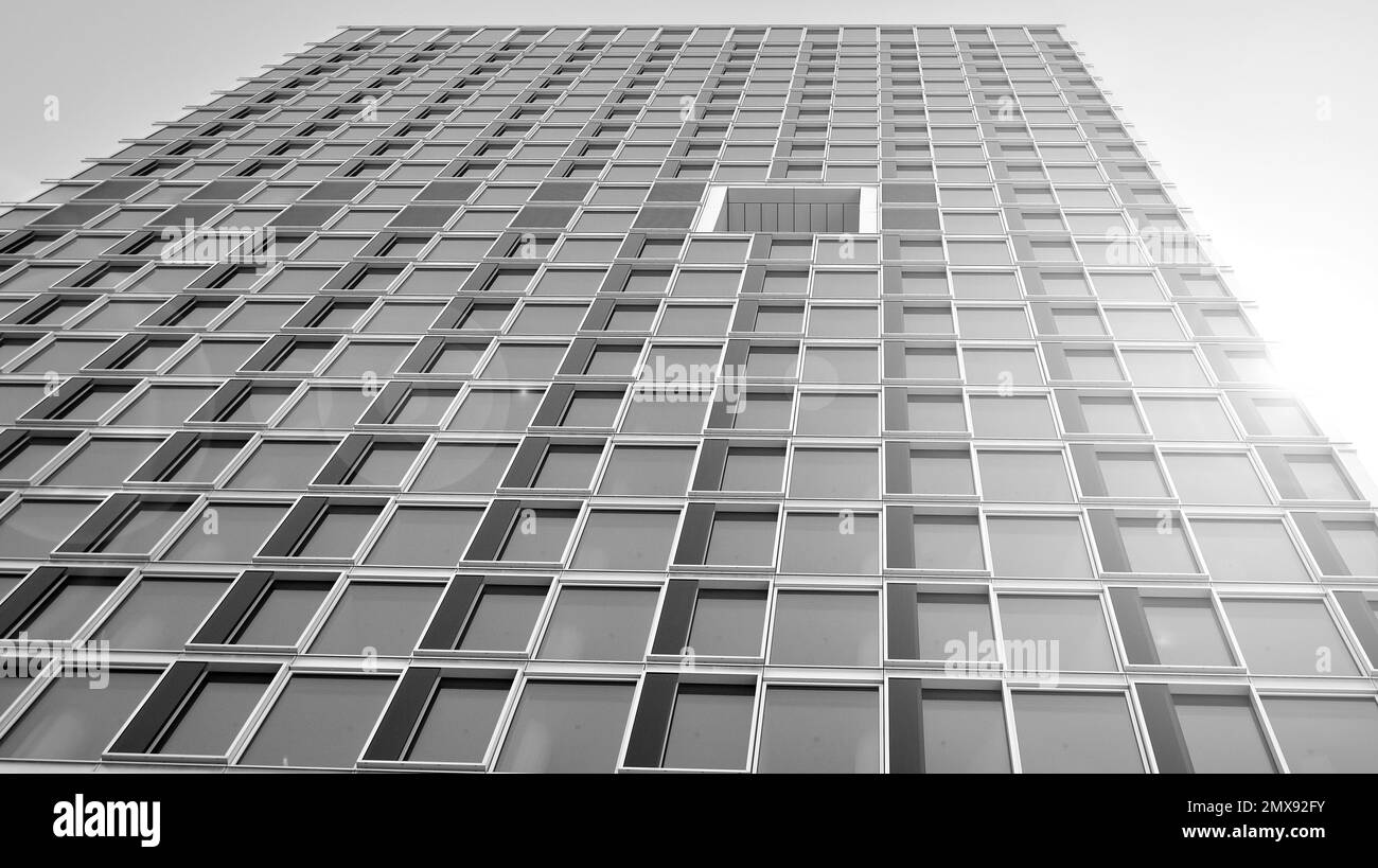 Commercial building close up in blue tone. Gigantic skyscraper from ...