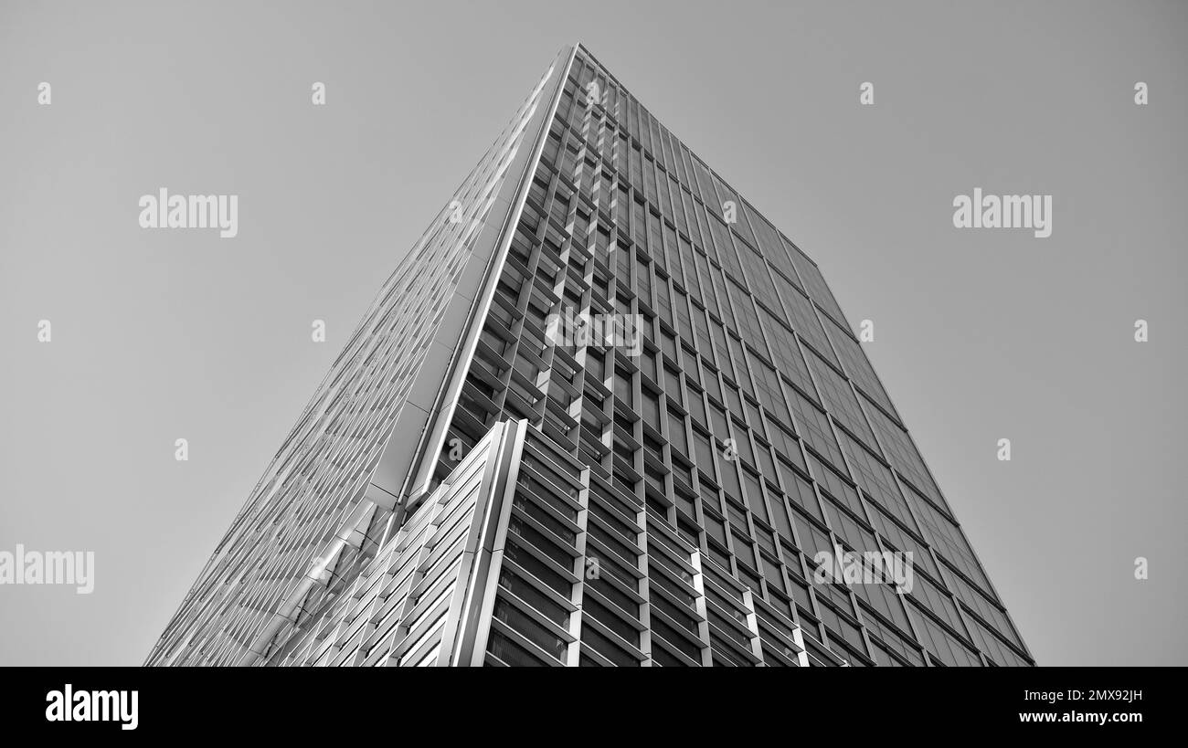 Commercial building close up in blue tone. Gigantic skyscraper from ...