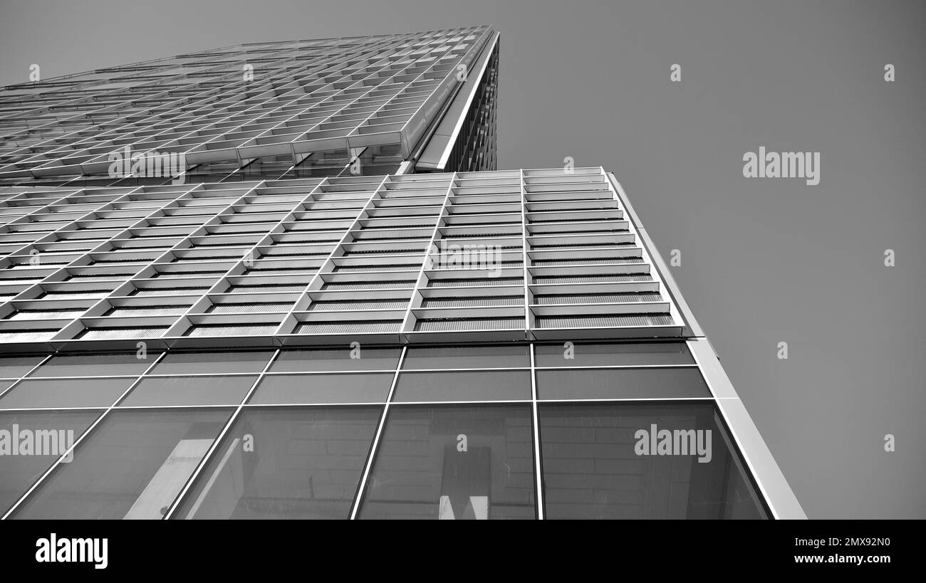 Commercial building close up in blue tone. Gigantic skyscraper from ...