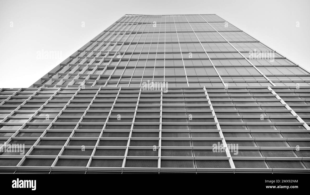 Commercial building close up in blue tone. Gigantic skyscraper from ...