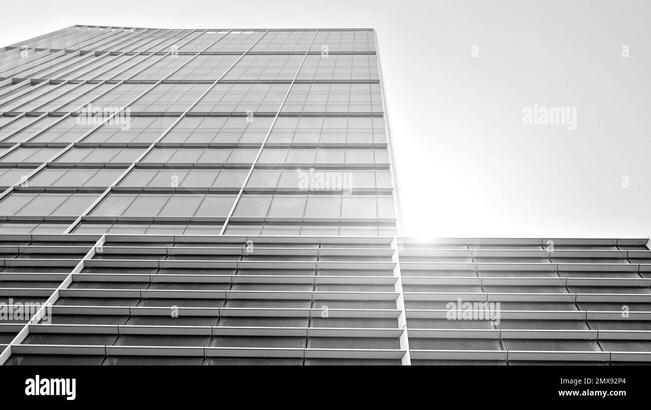 Commercial building close up in blue tone. Gigantic skyscraper from ...
