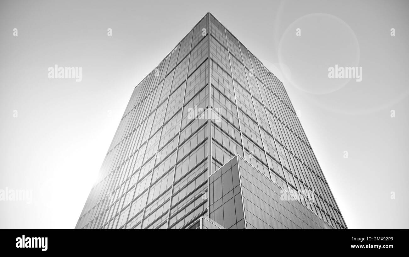 Commercial building close up in blue tone. Gigantic skyscraper from ...