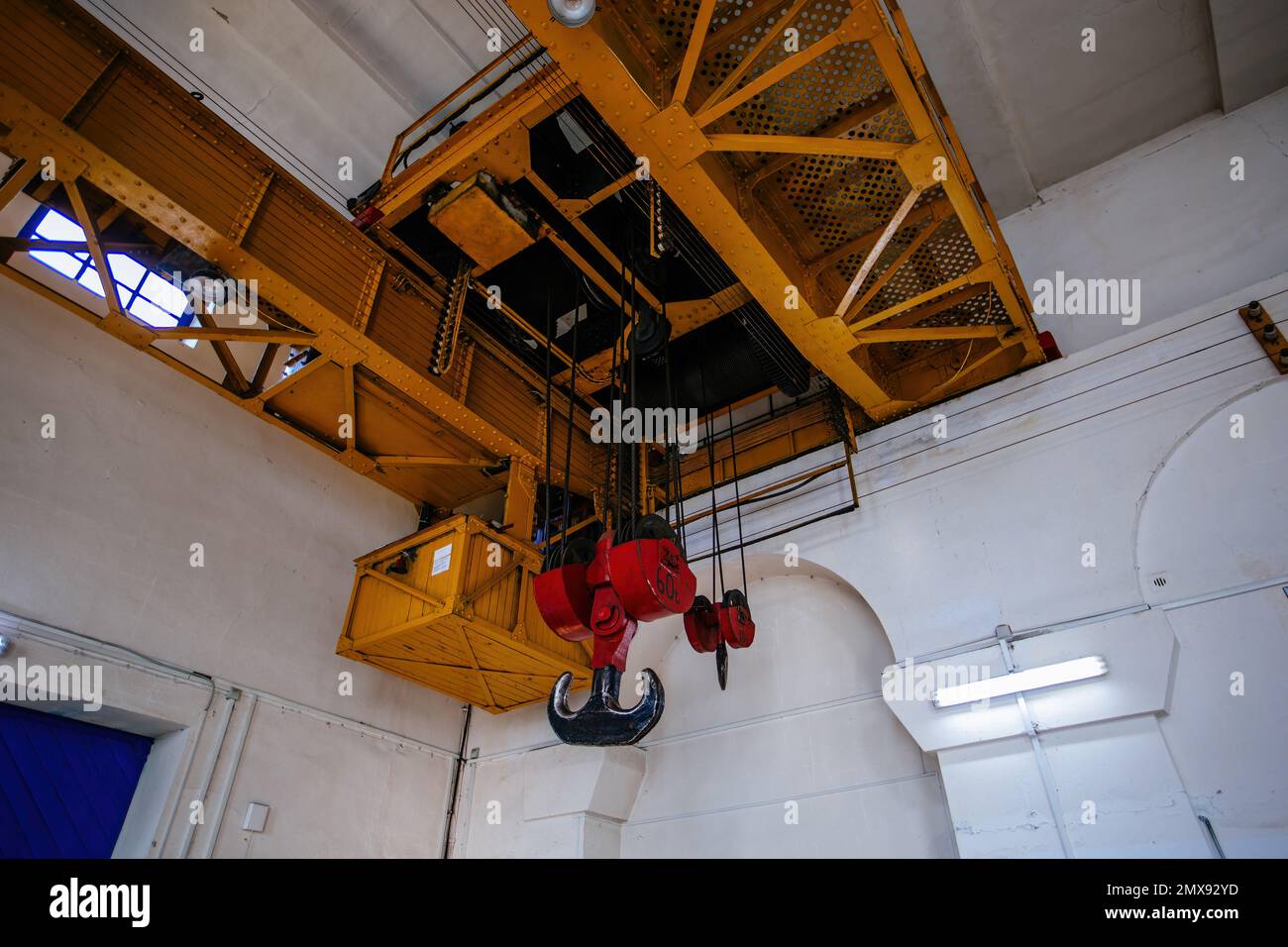 Overhead crane in the industrial building, close up Stock Photo - Alamy