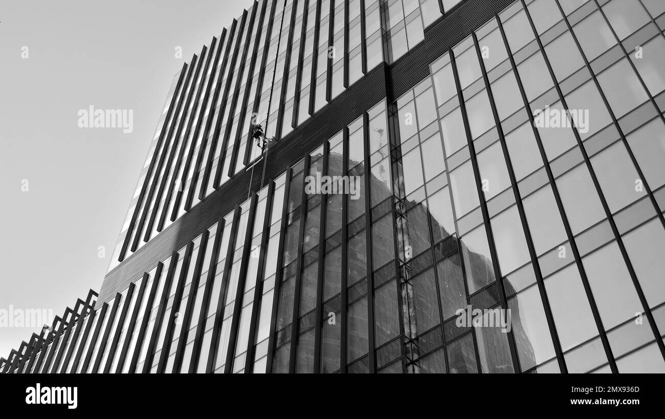 Commercial building close up in blue tone. Gigantic skyscraper from ...