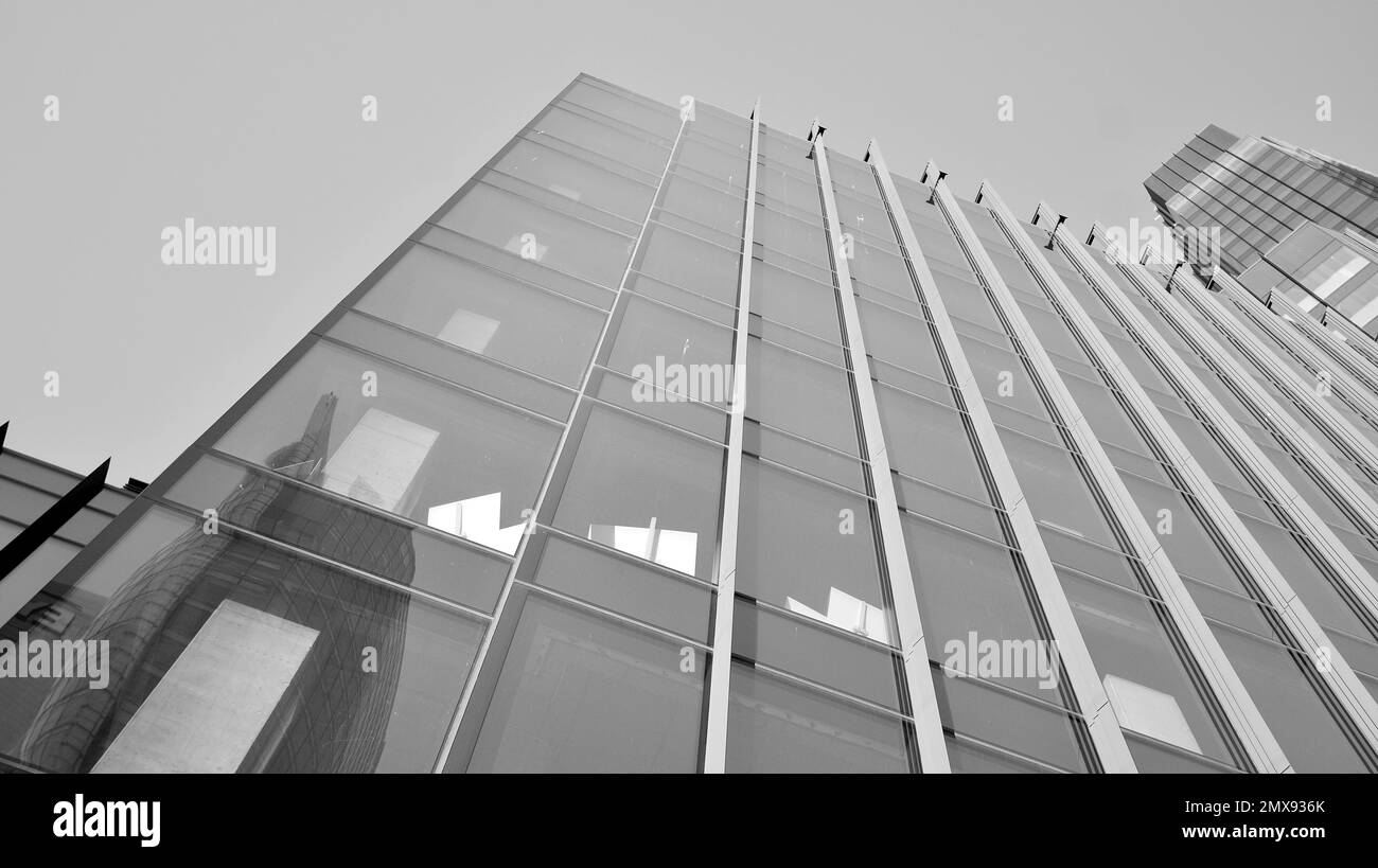 Commercial building close up in blue tone. Gigantic skyscraper from ...