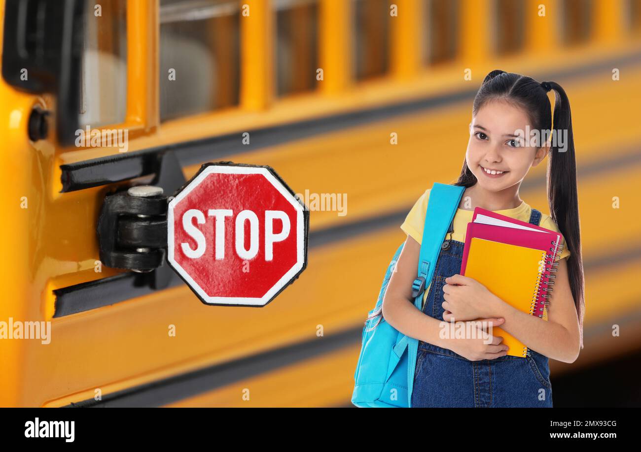 Girl with backpack near yellow school bus. Transport for students Stock ...