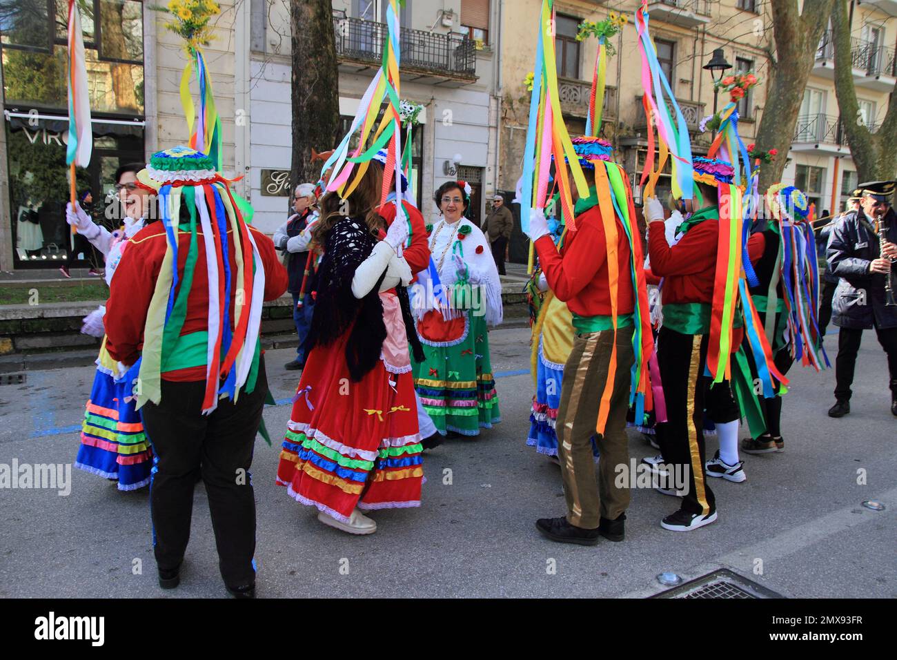 People with carnival costumes dance and parade through the streets of ...