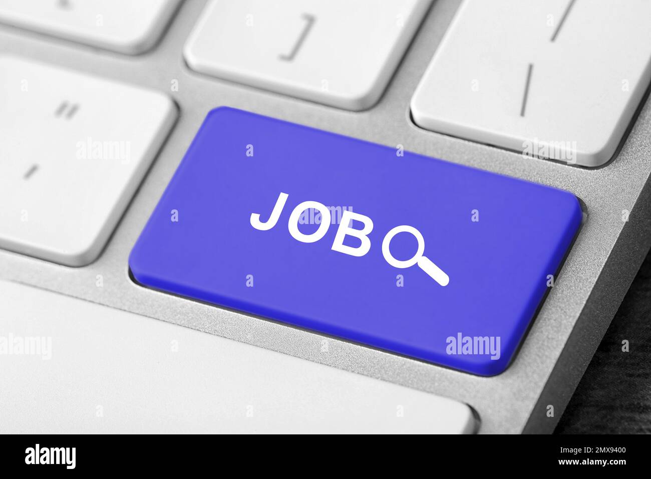 Modern computer keyboard with blue button, closeup view. Job search Stock Photo - Alamy