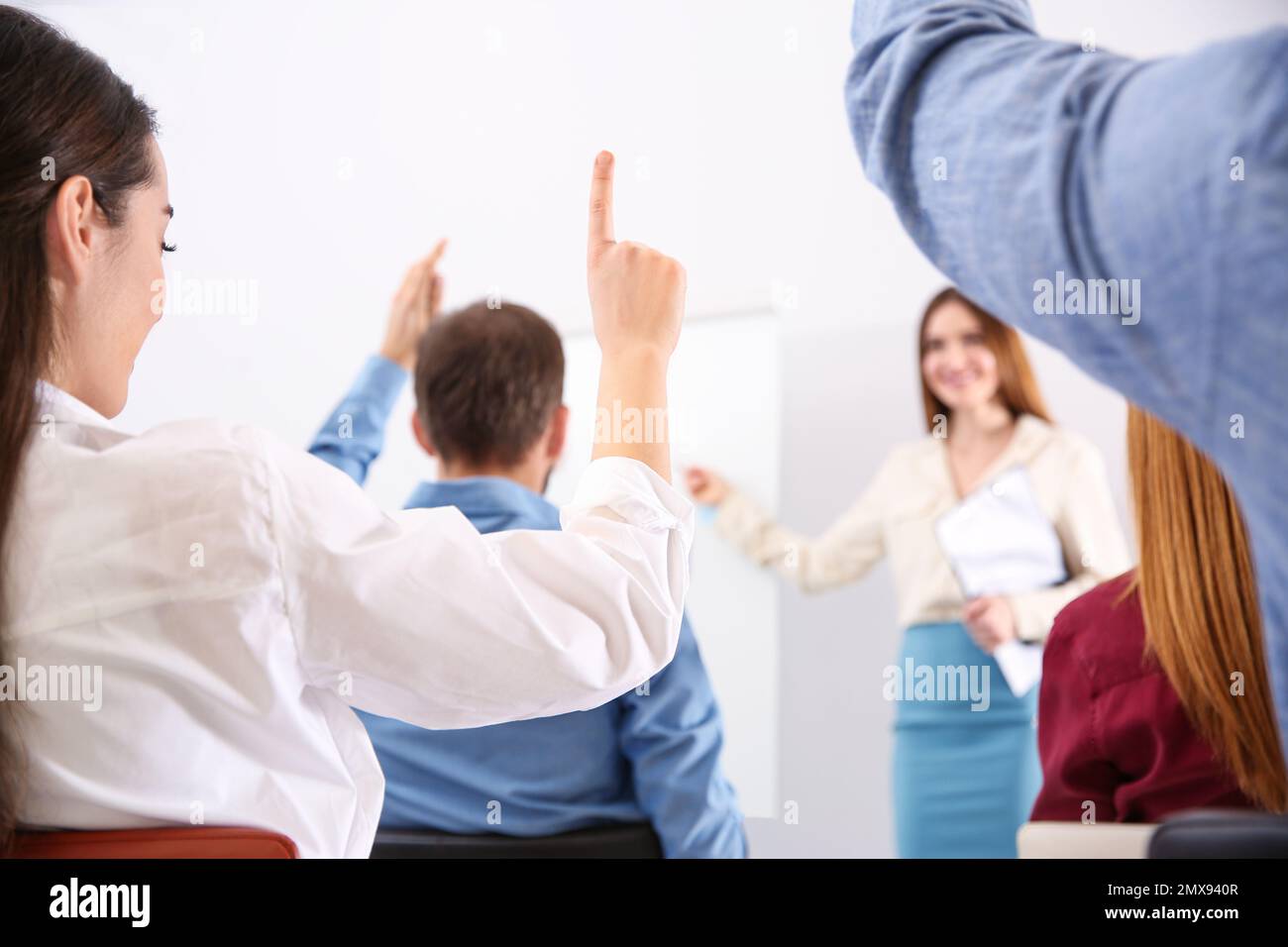 Woman raising finger ask hi-res stock photography and images - Alamy
