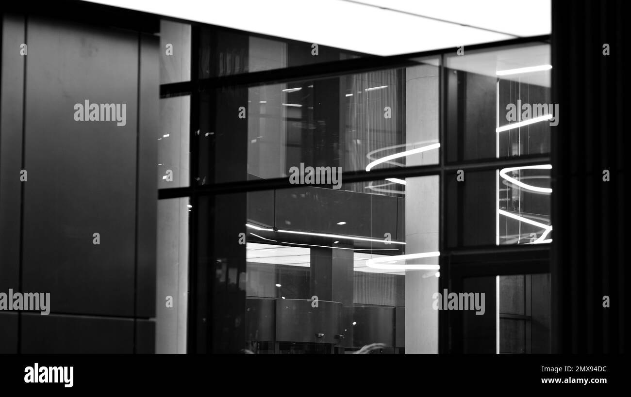 Pattern of office buildings windows illuminated at night. Lighting with ...