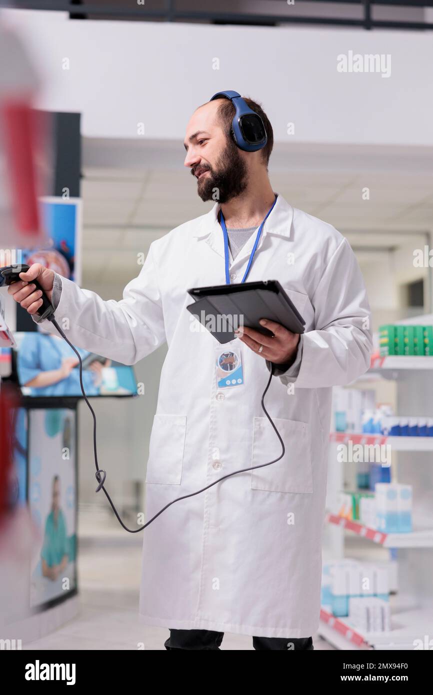 Pharmacist scanning medication scanner hi-res stock photography and ...