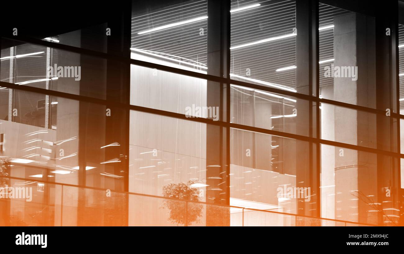 Pattern of office buildings windows illuminated at night. Lighting with ...