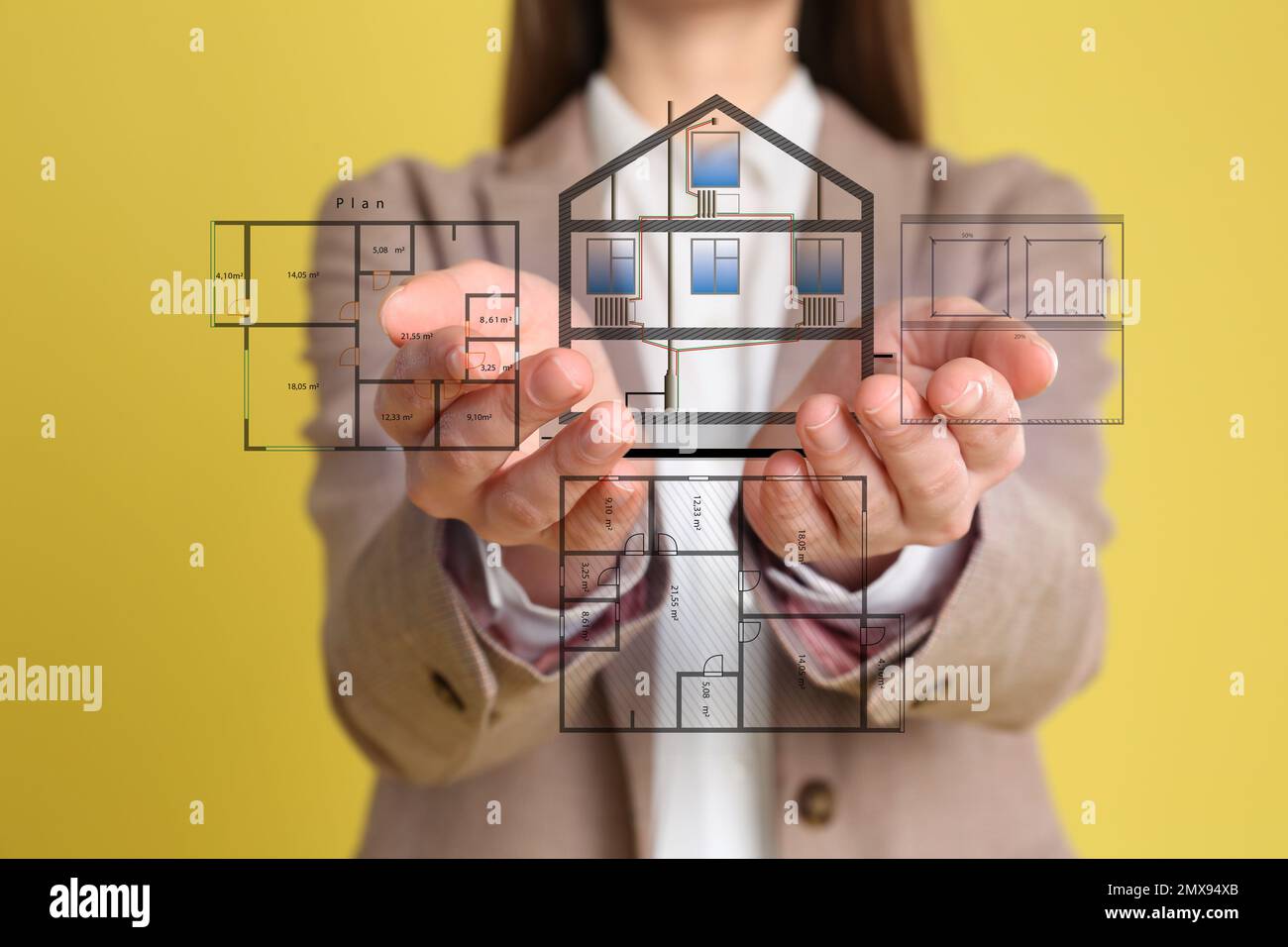 Designer presenting project of house with planning and heating system ...