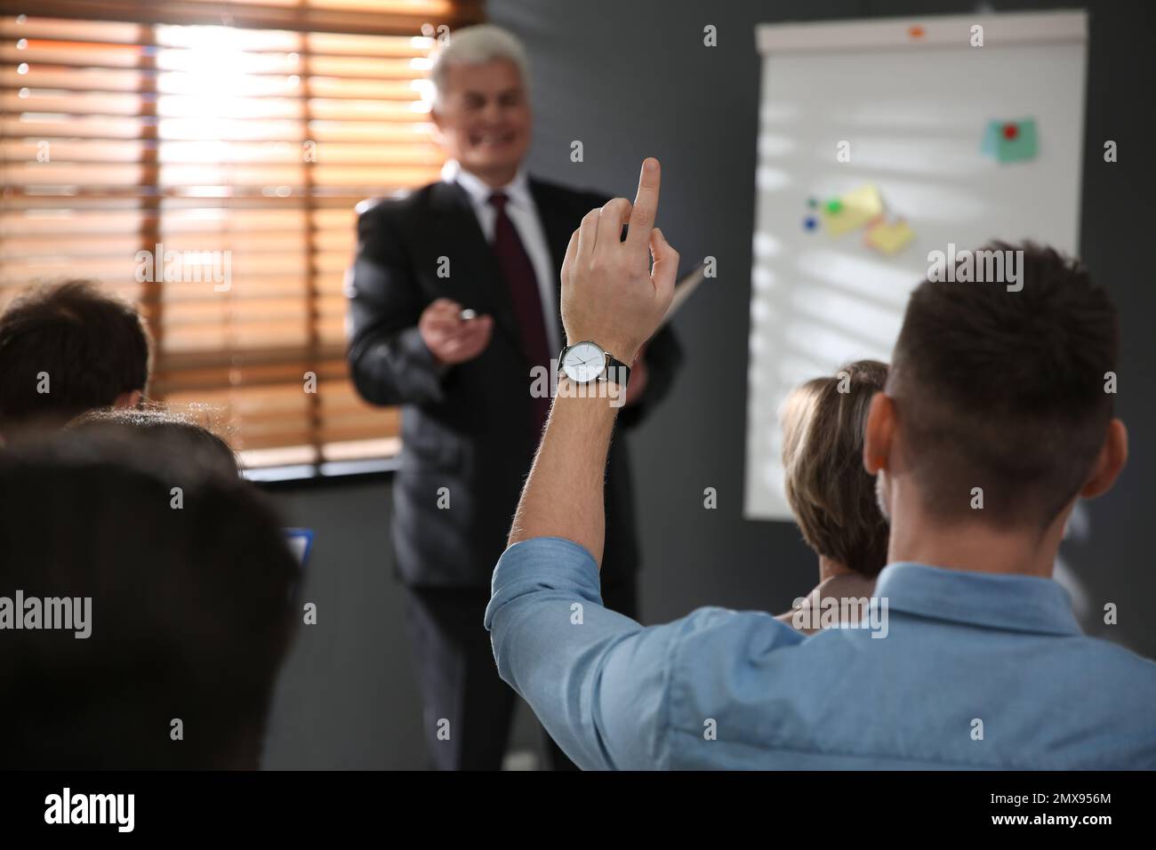 Hand raising speaker hi-res stock photography and images - Alamy