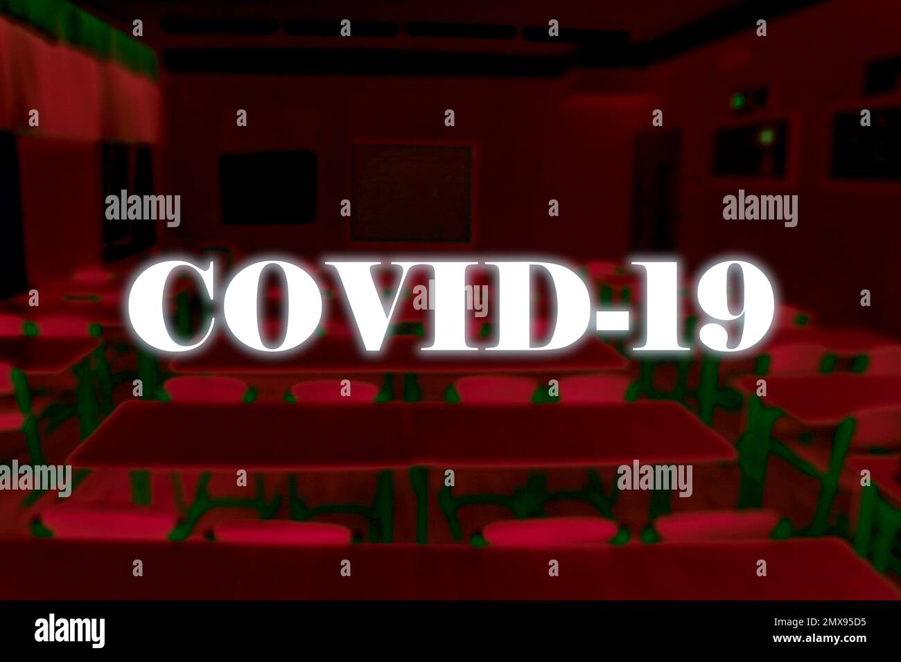 Text COVID-19 and empty classroom, view through UV filter. School ...
