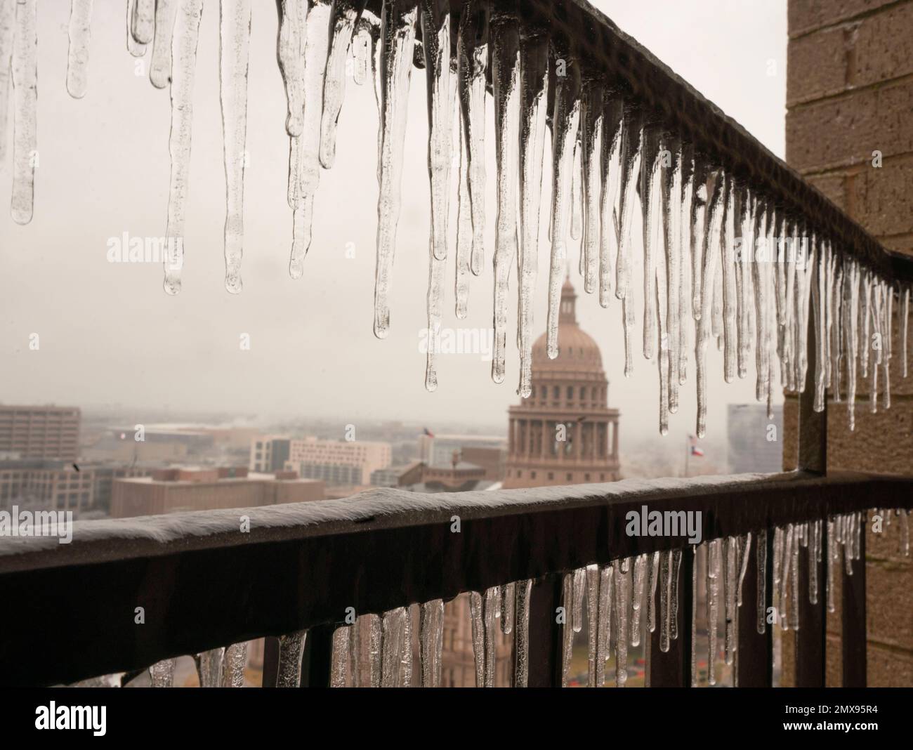 Austin Texas USA, February 1 2023: Icicles drip from a balcony with the ...