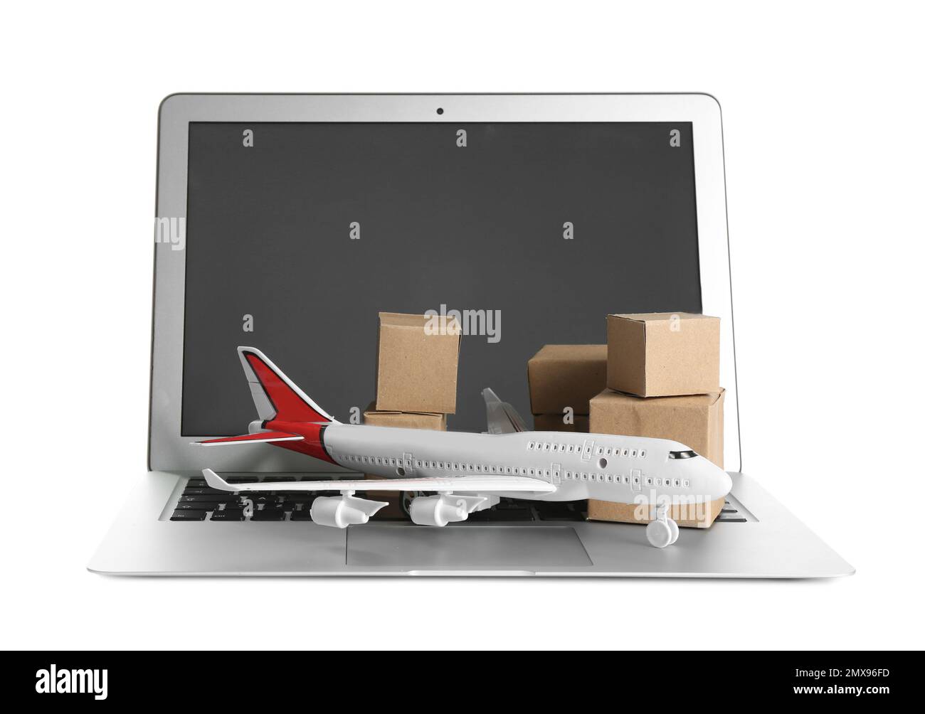 Laptop, airplane model and carton boxes on white background. Courier ...