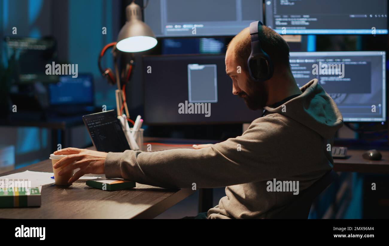 IT coder taking supplements out of box in office, using vitamins pills ...