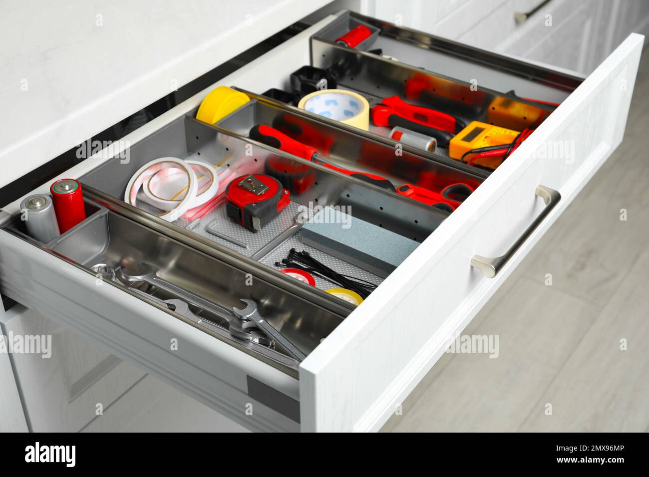 Set of instruments in open desk drawer indoors Stock Photo - Alamy
