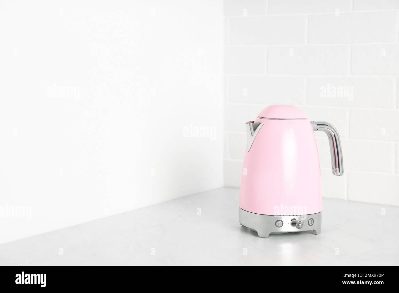 Modern electric kettle on counter in kitchen. Space for text Stock ...
