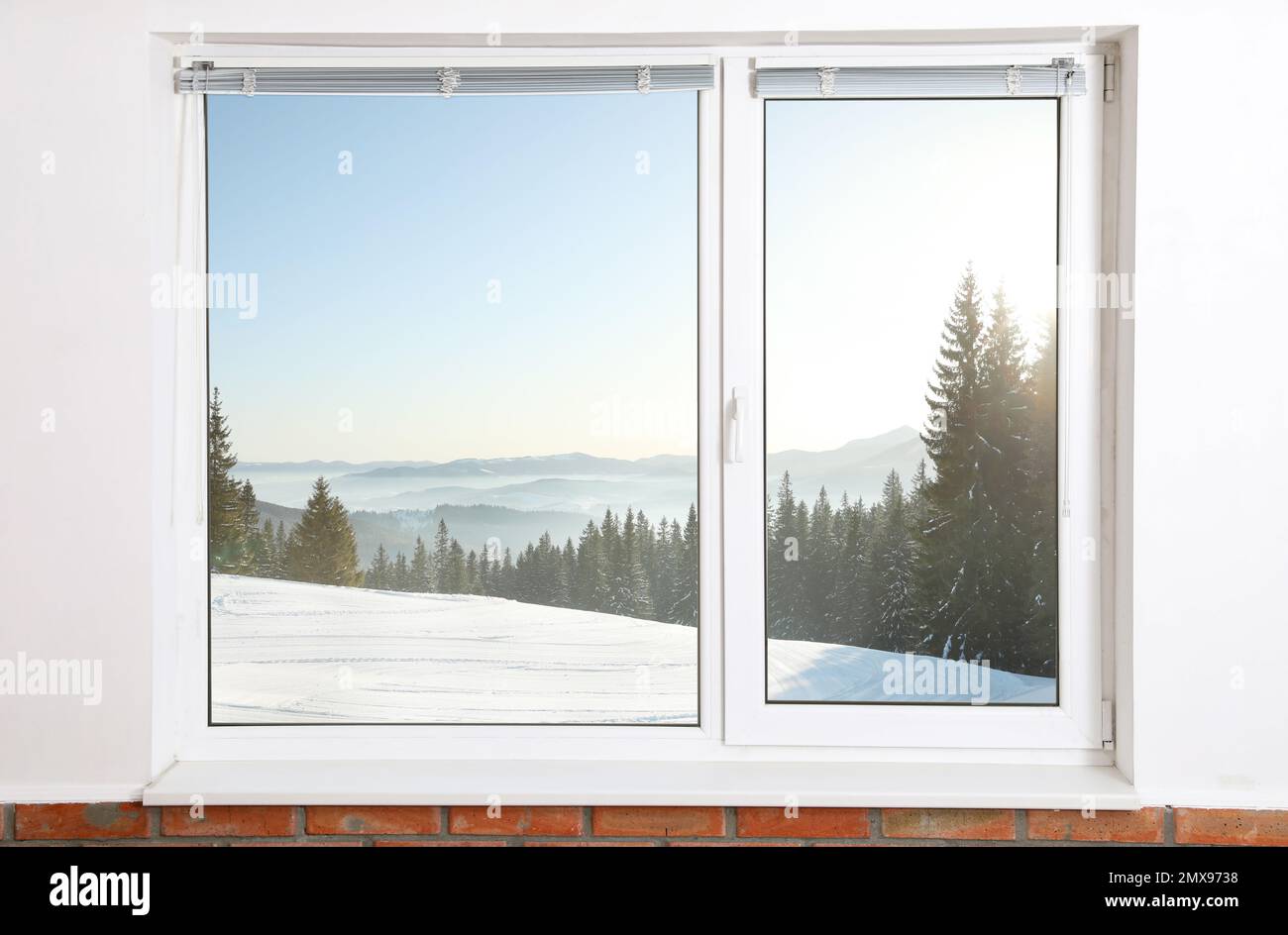 Beautiful view of snowy forest through big window Stock Photo - Alamy