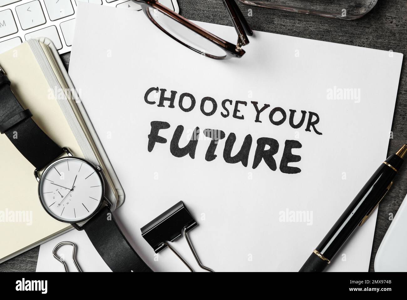 Flat lay composition with phrase CHOOSE YOUR FUTURE on grey stone ...