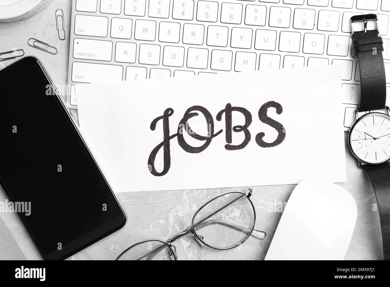 Flat lay composition with word JOBS, computer keyboard and smartphone ...