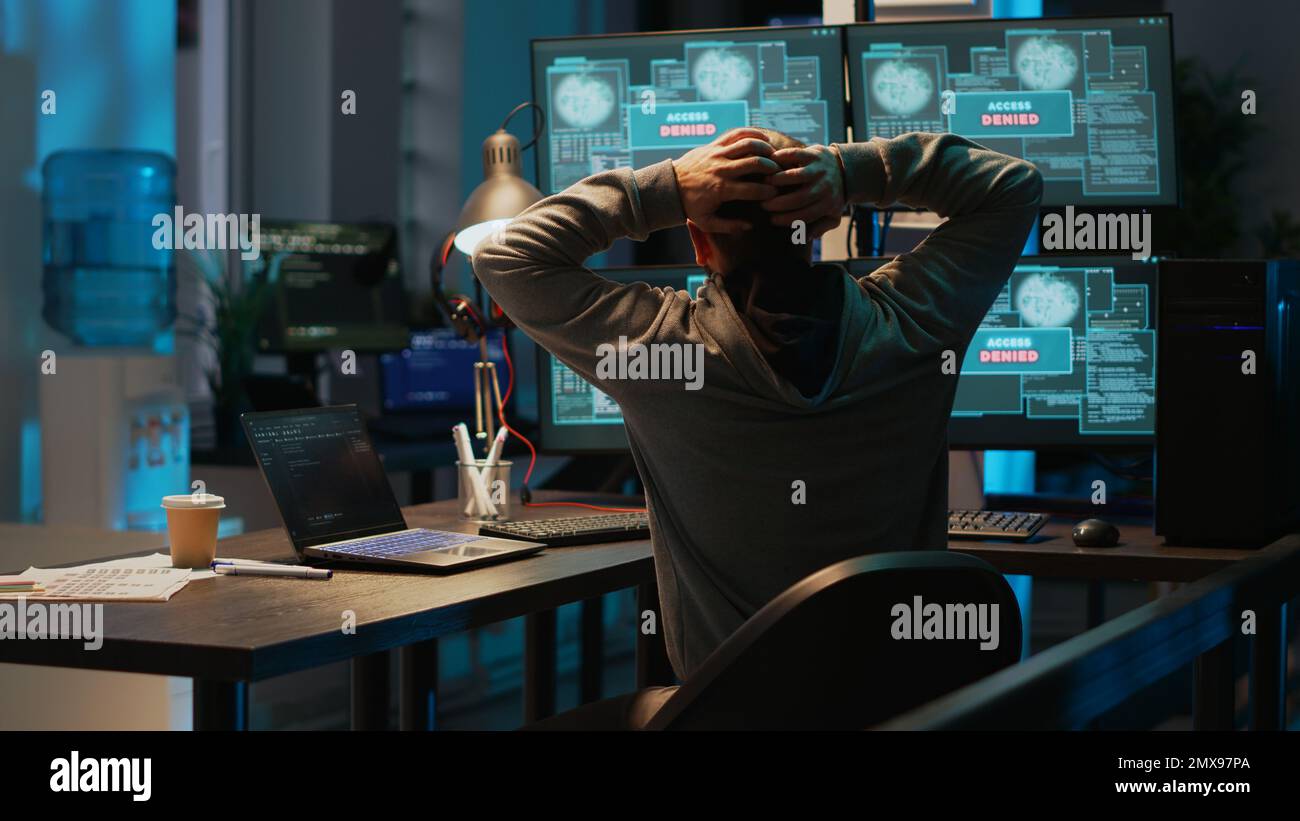 Frustrated Hacker Using Computer To Break Into Corporate Data Servers