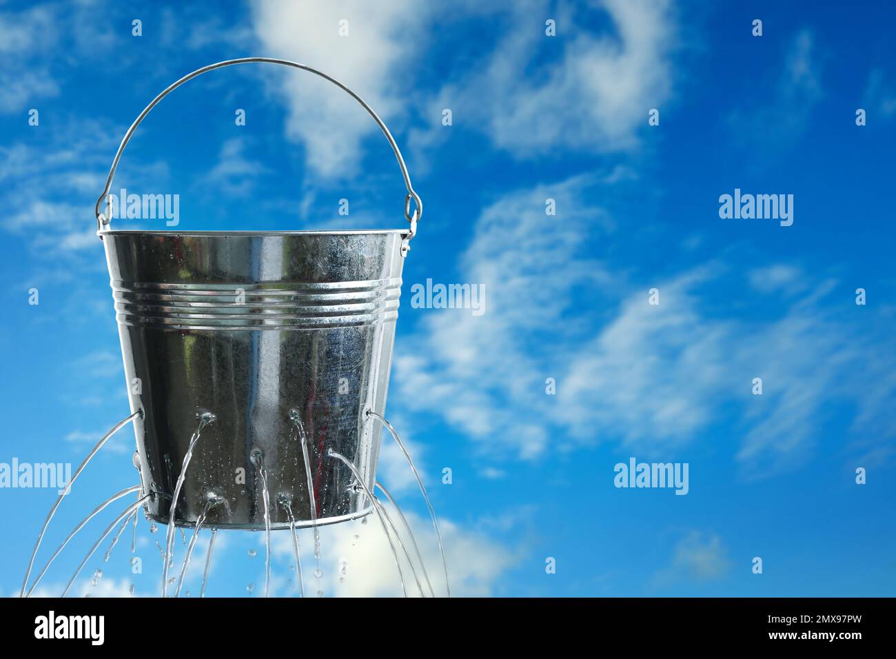 Bucket with holes and water hi-res stock photography and images - Alamy