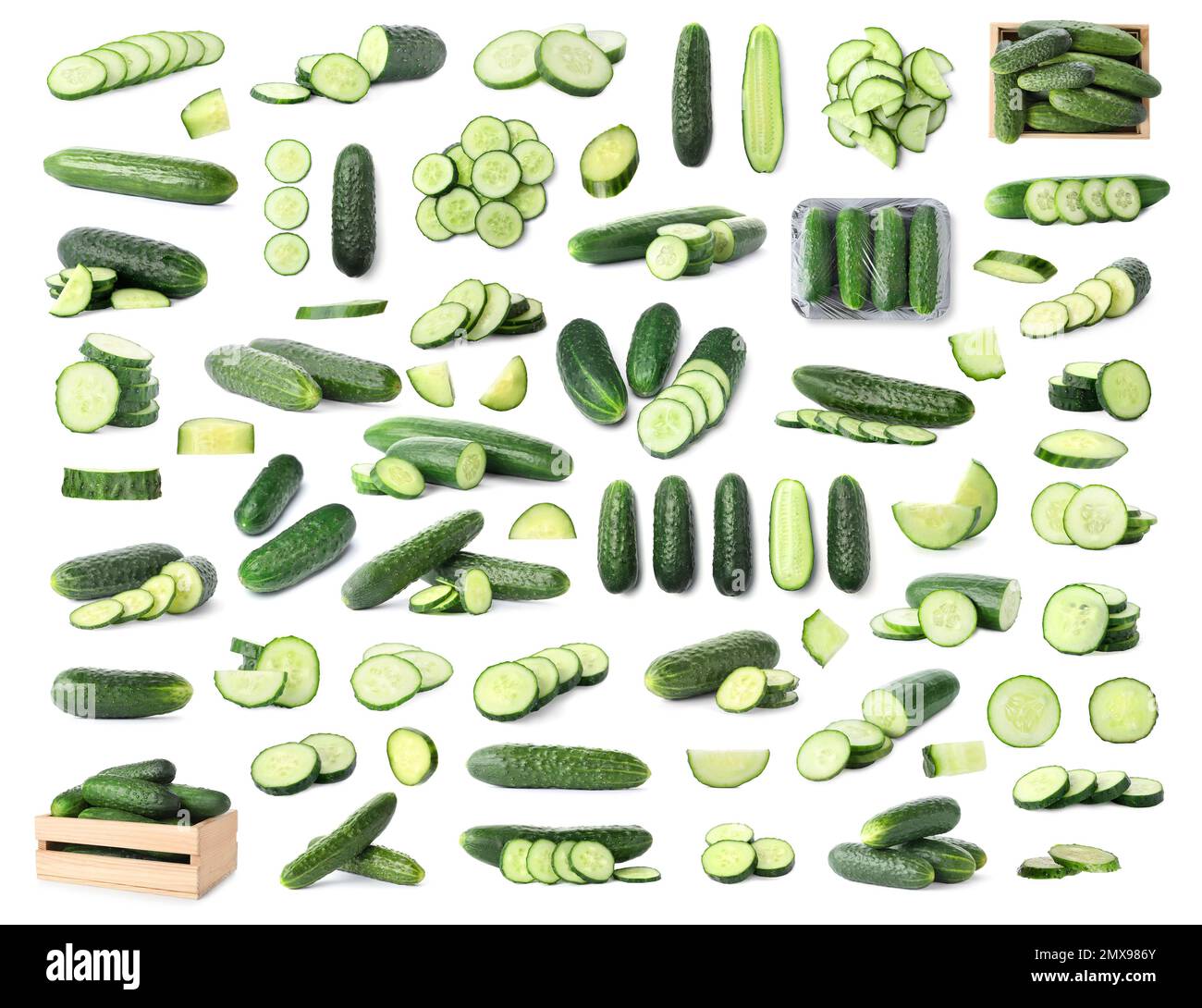 Set with whole and sliced cucumbers on white background Stock Photo - Alamy