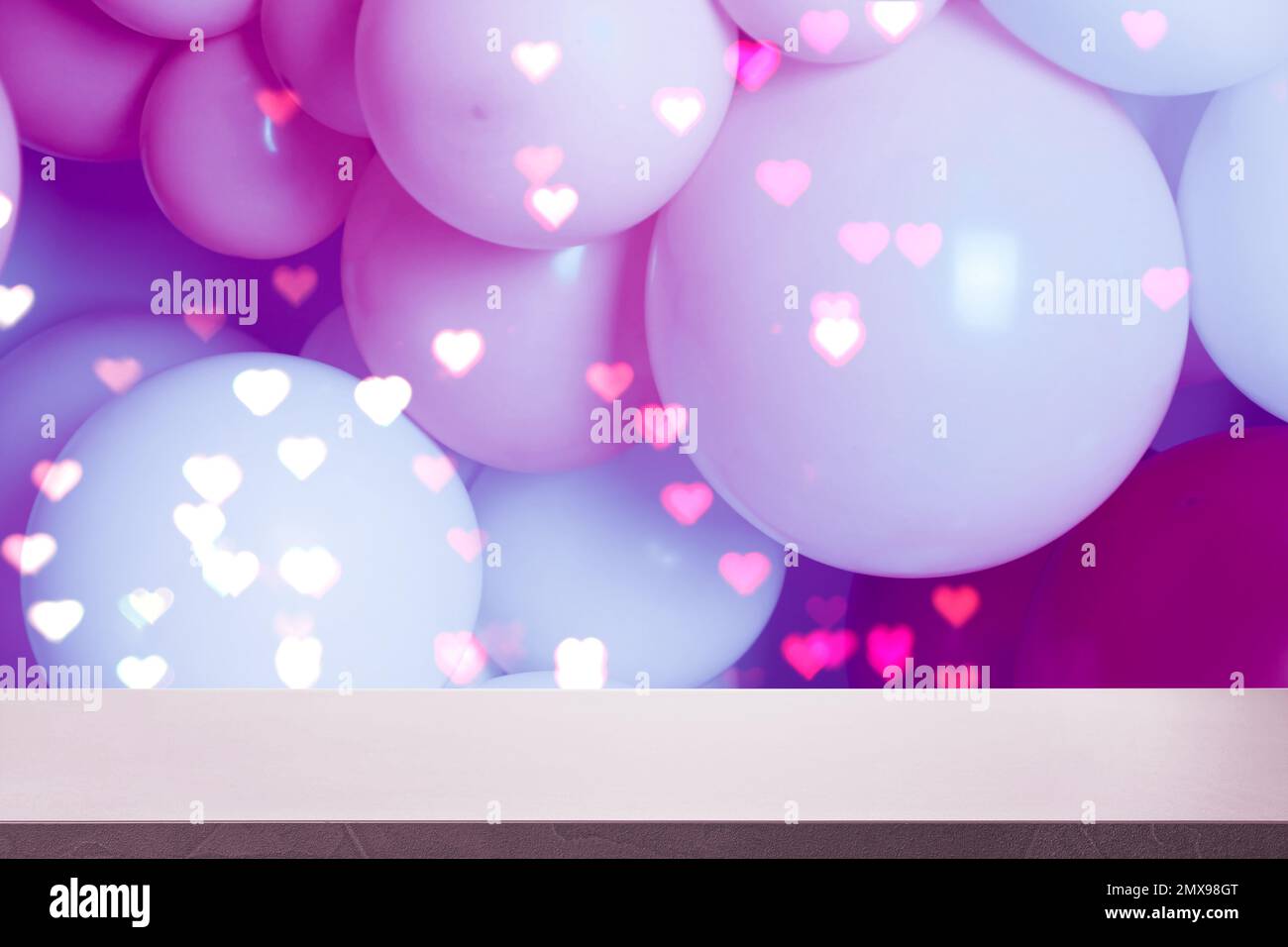 Empty stone surface and balloons on background. Party decor Stock Photo ...