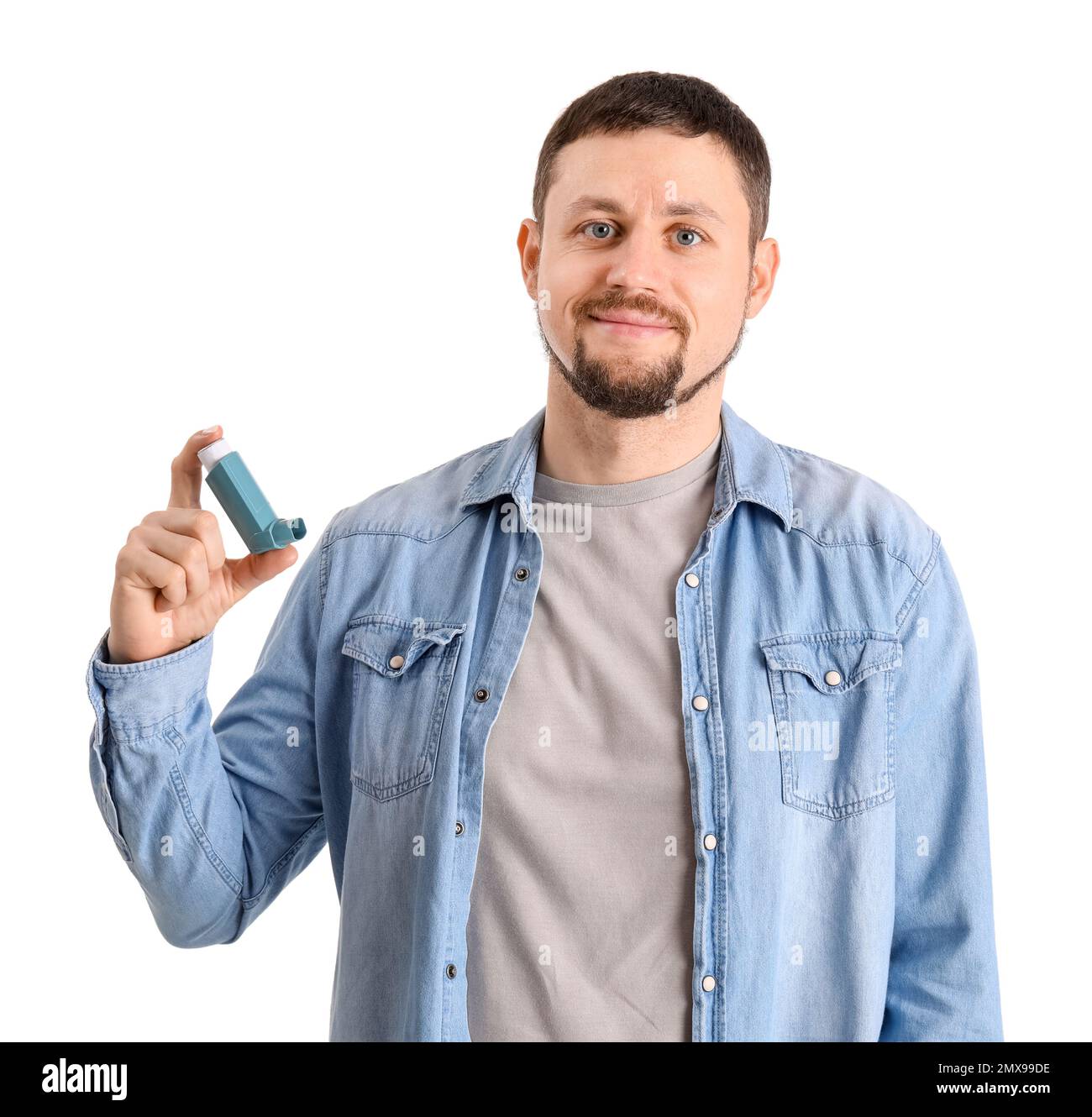 Man with inhaler on white background Stock Photo - Alamy