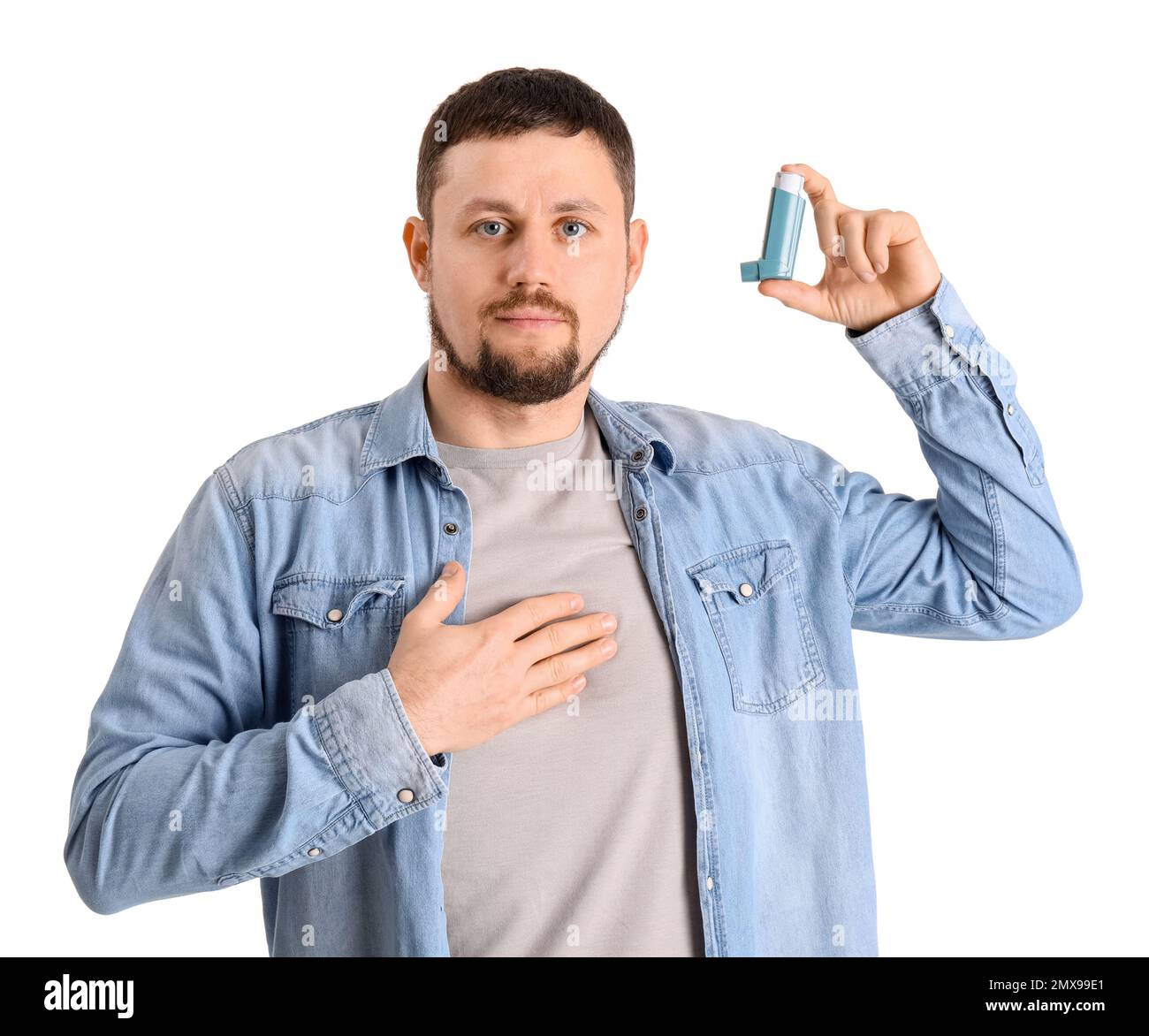 Man with inhaler on white background Stock Photo - Alamy